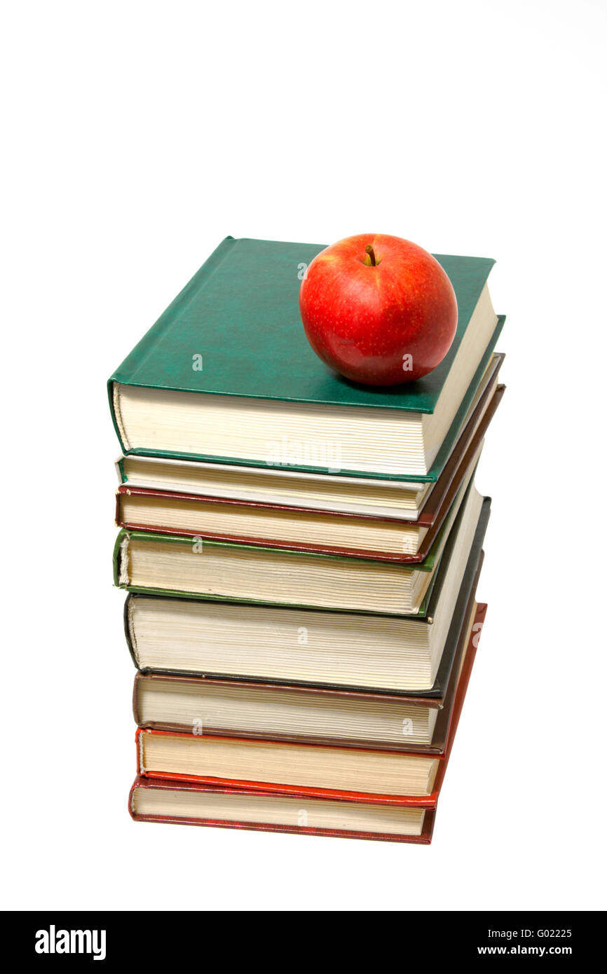 apple and stack of books isolated on white background Stock Photo - Alamy