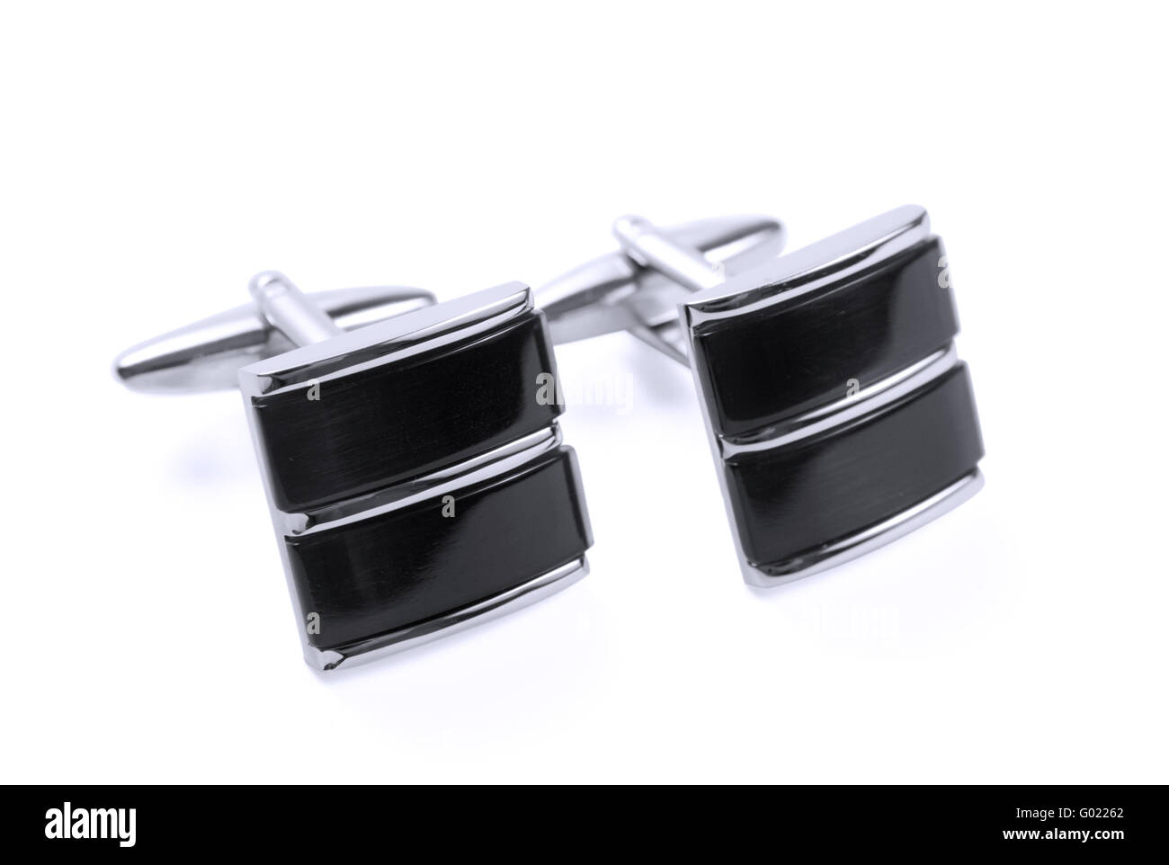 a pair of stainless steel cufflinks on white Stock Photo - Alamy