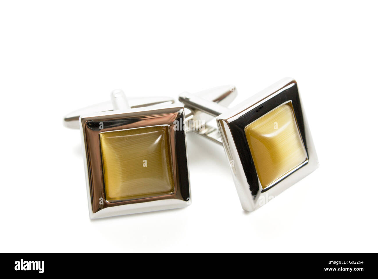 a pair of stainless steel cufflinks on white Stock Photo - Alamy