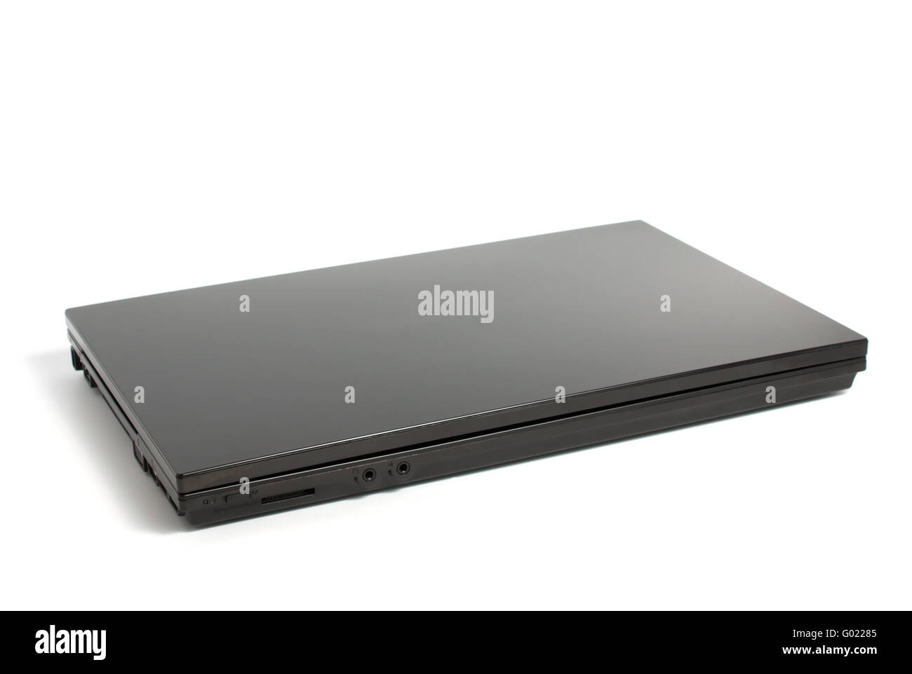 closed black laptop isolated on the white background Stock Photo - Alamy