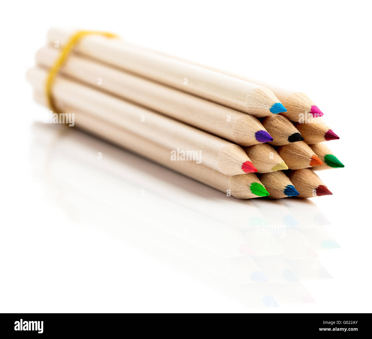 many colored pencils in row over white background Stock Photo - Alamy