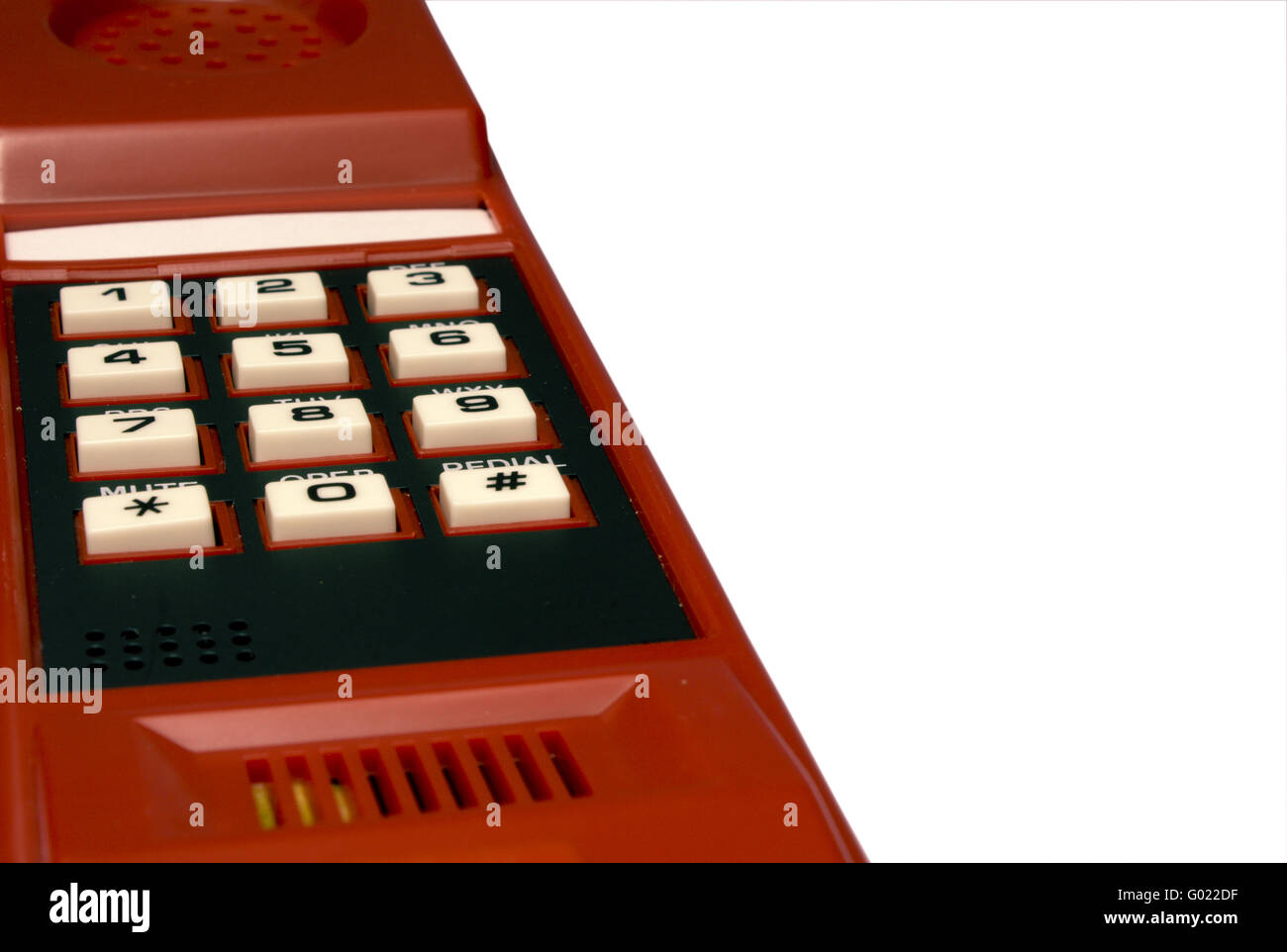 keyboard on a telephone tube of red color with white buttons and black ...