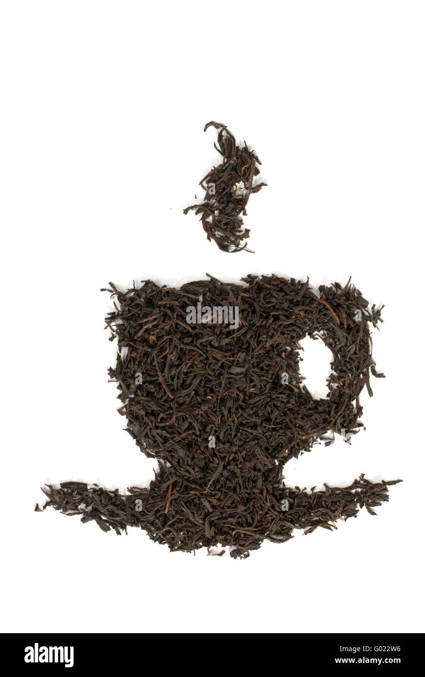 Black tea heap in mug shape on white background. Close-up Stock Photo ...
