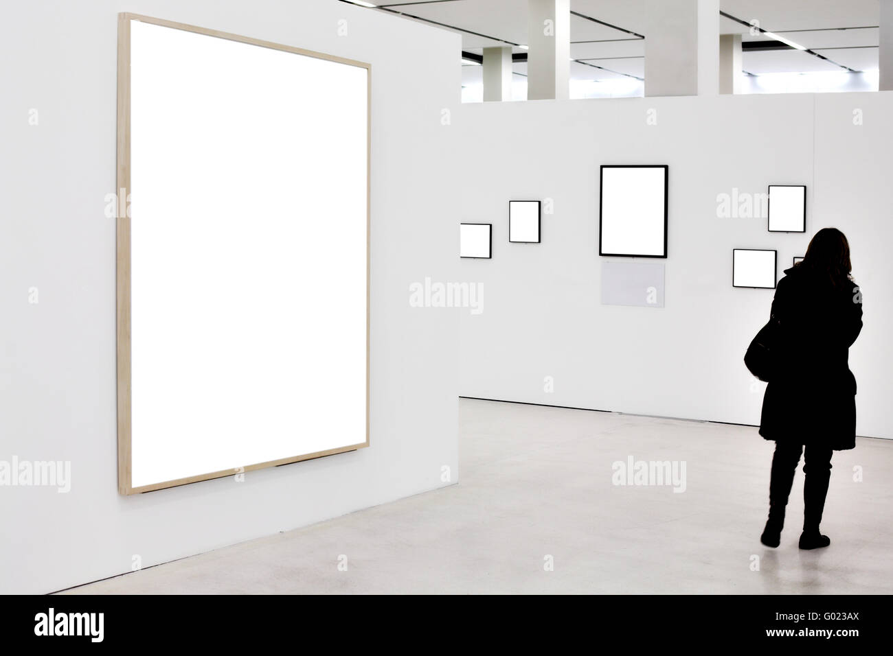 Walls in museum with empty frames and person move Stock Photo - Alamy