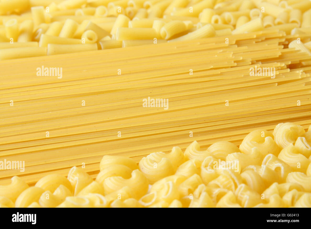 A lot of pasta. Background made from spaghetti and penne Stock Photo ...