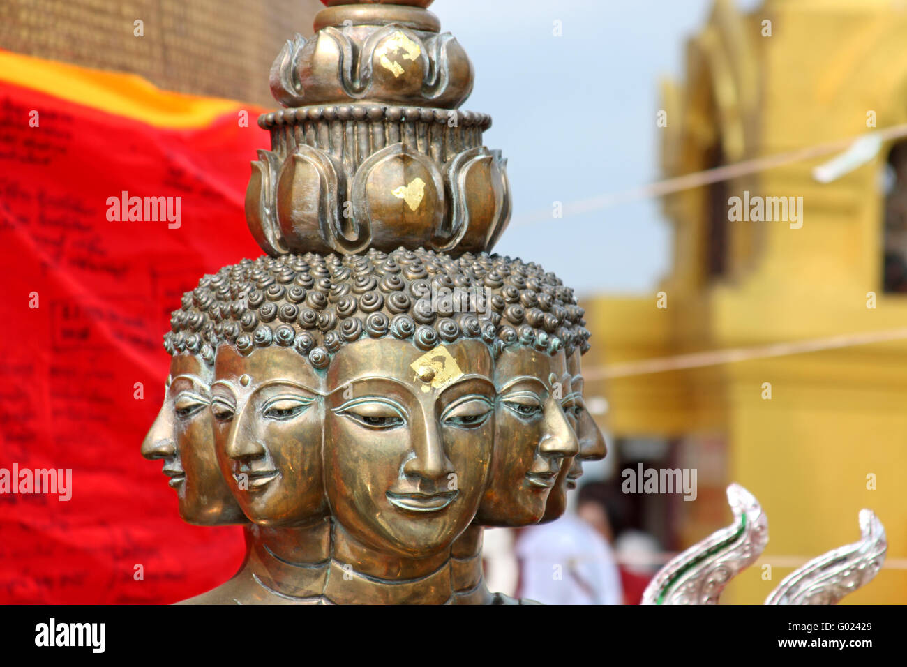 Golden statue of Buddha with many faces. Golden Mount temple Stock ...
