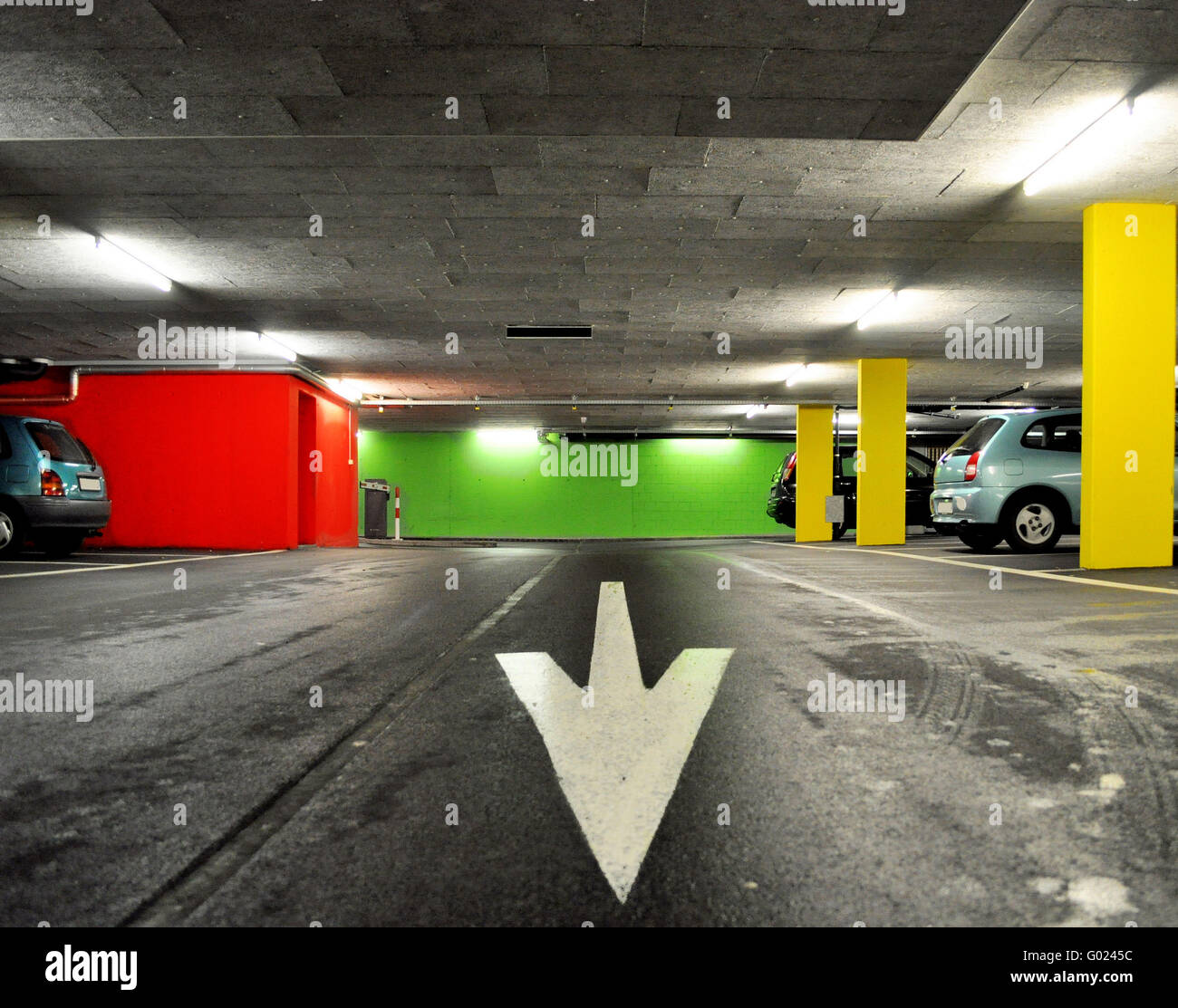 Cars on the ground level of a multistory parking garage Stock Photo - Alamy