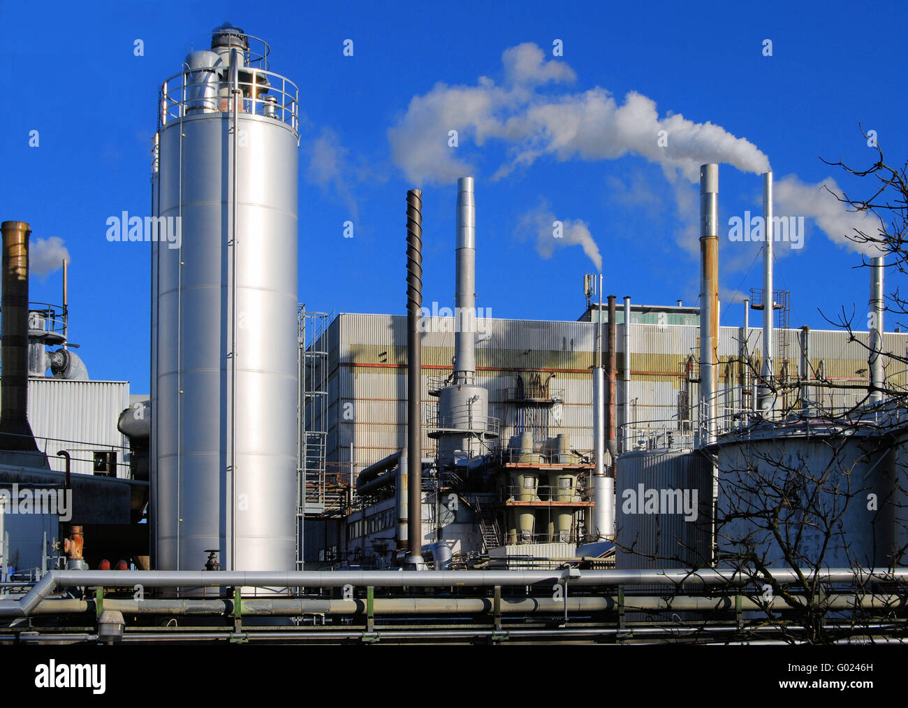 Industrial site with smoking stacks Stock Photo - Alamy