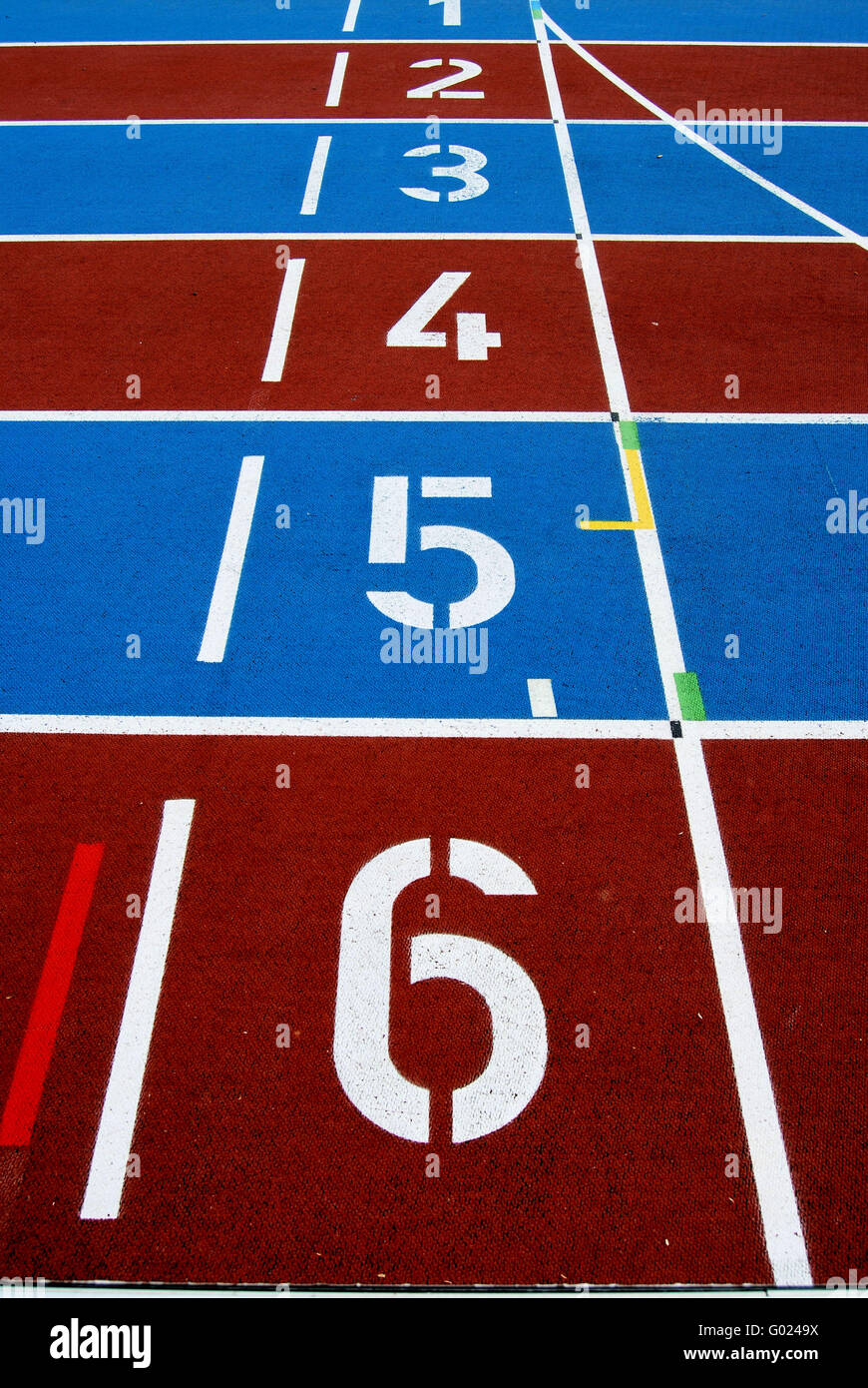 Starting numbers on a red and blue striped athletic track Stock Photo ...