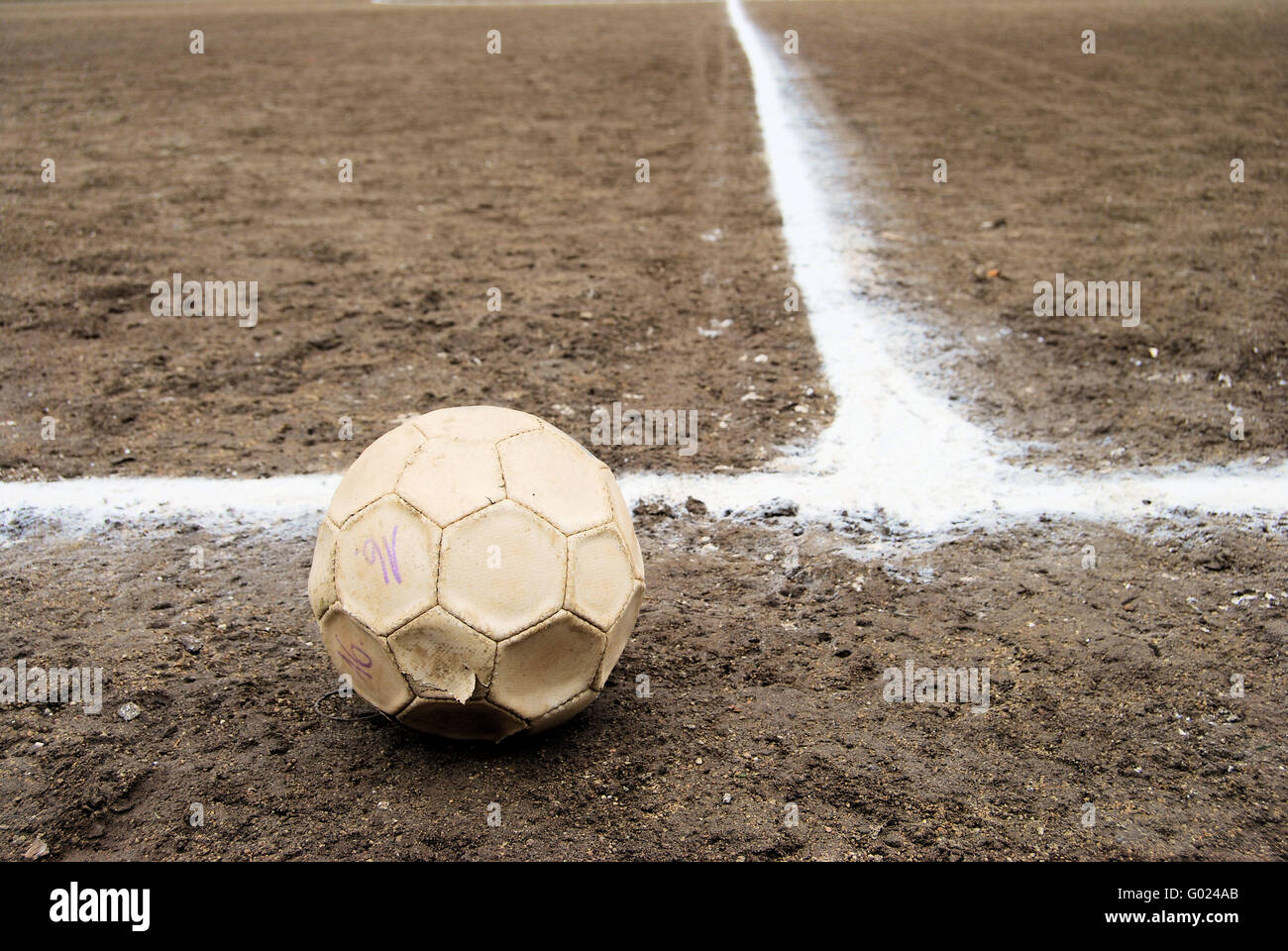 Soccer ball on a ash football court Stock Photo - Alamy
