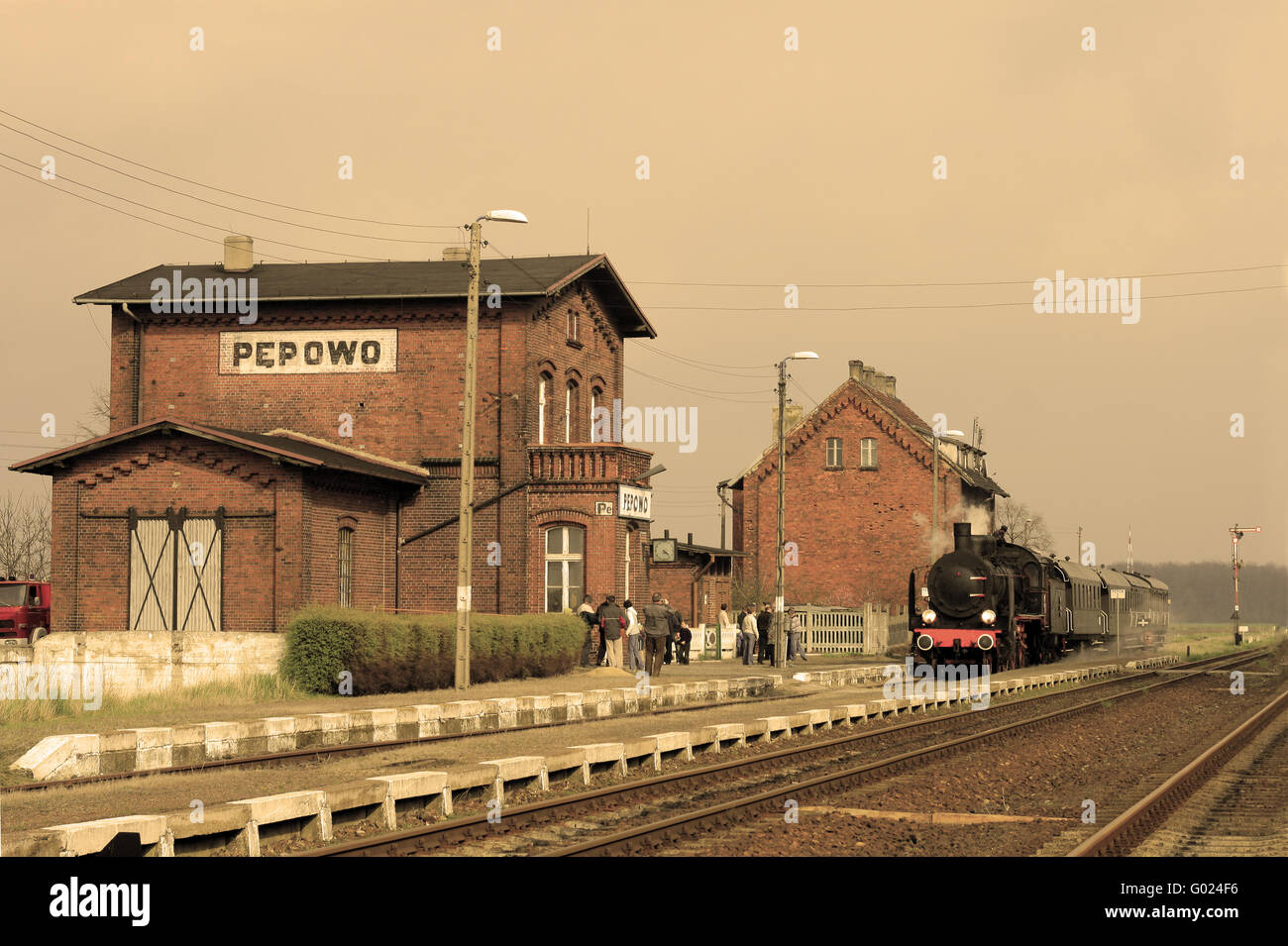 Old retro steam train stopped at the small station Stock Photo - Alamy