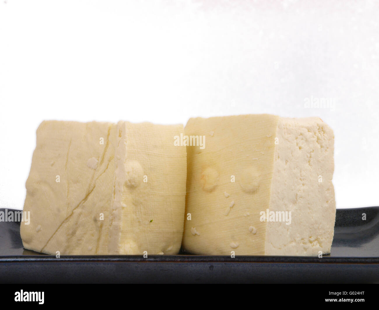 Fresh Chinese tofu. Close up on white background Stock Photo - Alamy