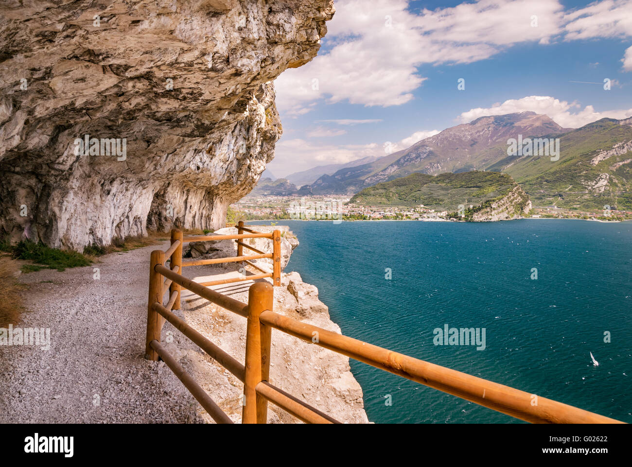 The Ponale trail carved into the rock of the mountain in Riva del Garda ...
