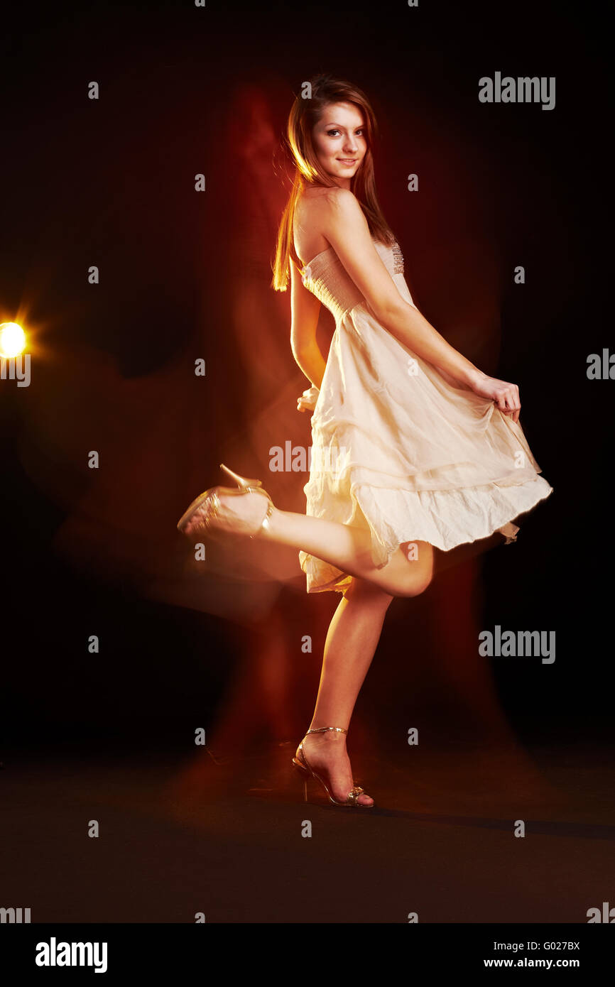Beautiful young female wearing dress, dancing, multiple exposure non ...