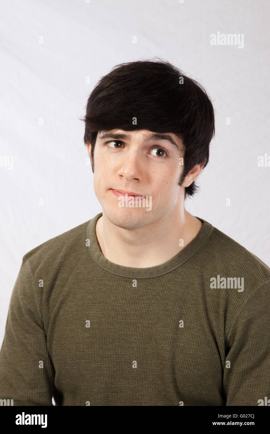 Handsome man looking puzzled and questioning Stock Photo - Alamy