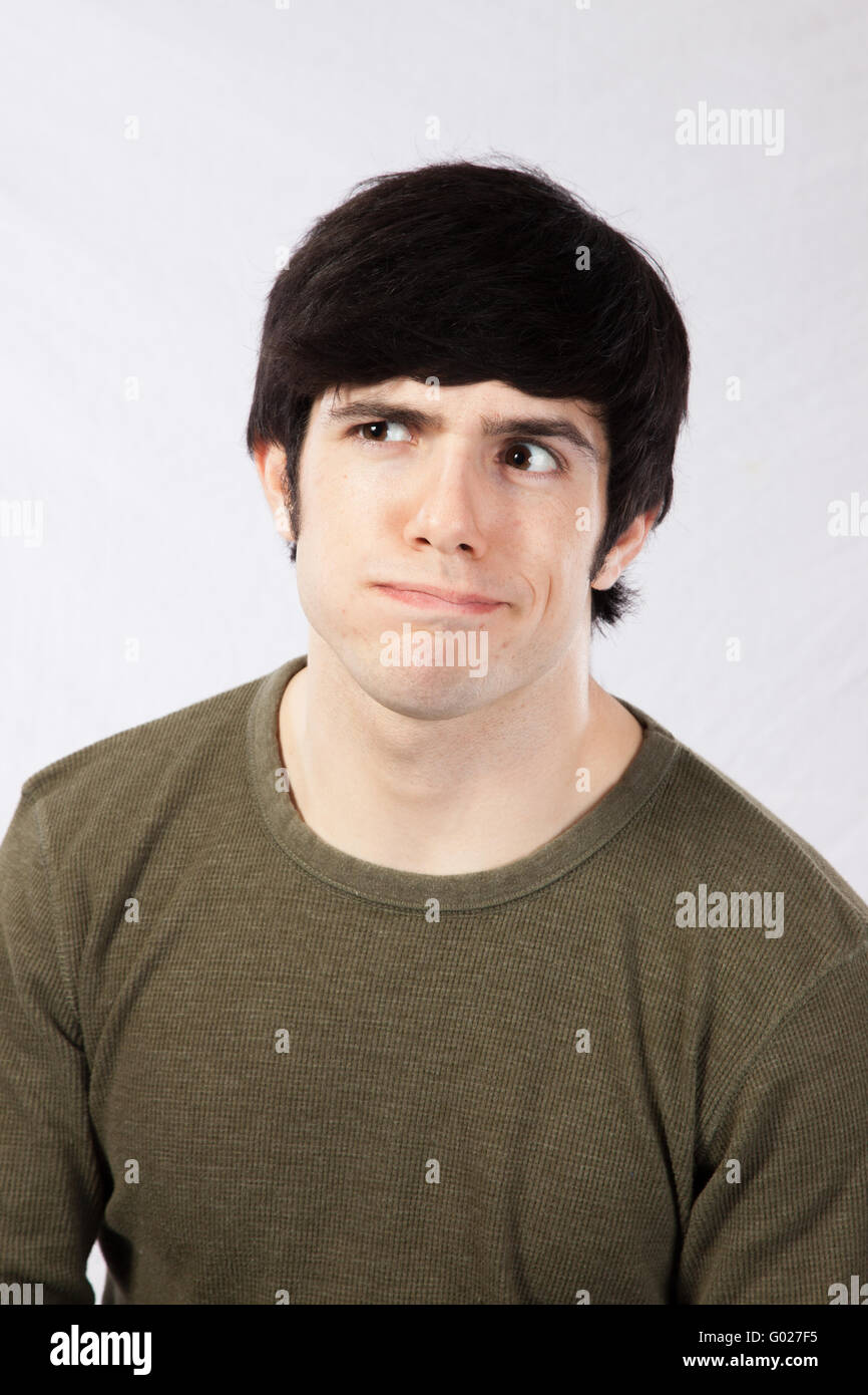 Handsome man looking puzzled and questioning Stock Photo - Alamy