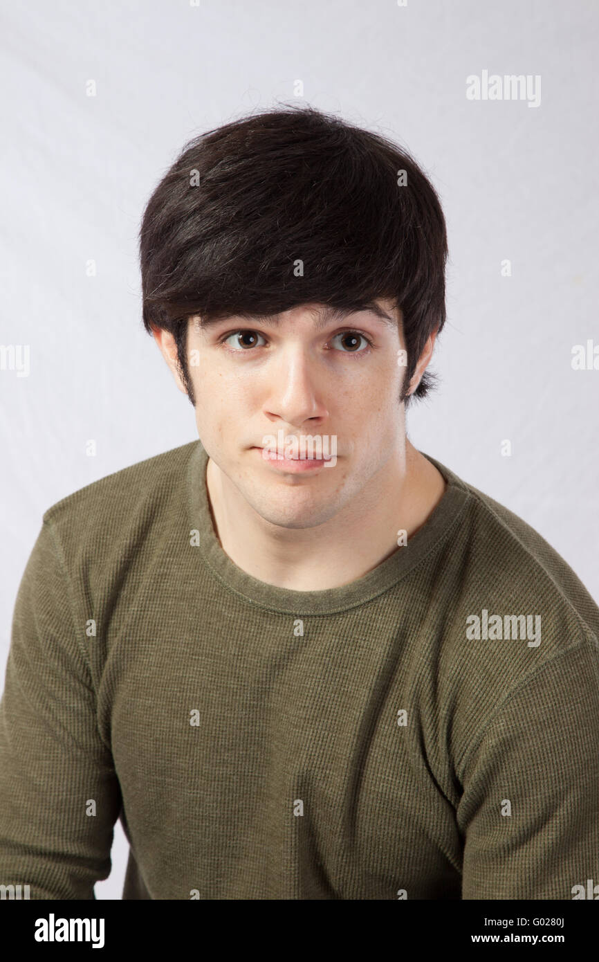 Handsome man looking at the camera with a happy expression Stock Photo ...