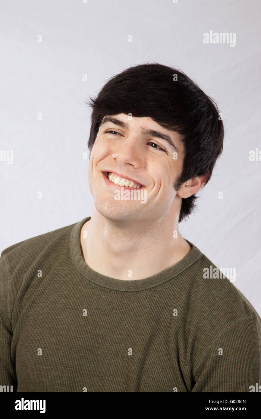 Handsome man looking to the left with a happy expression Stock Photo ...