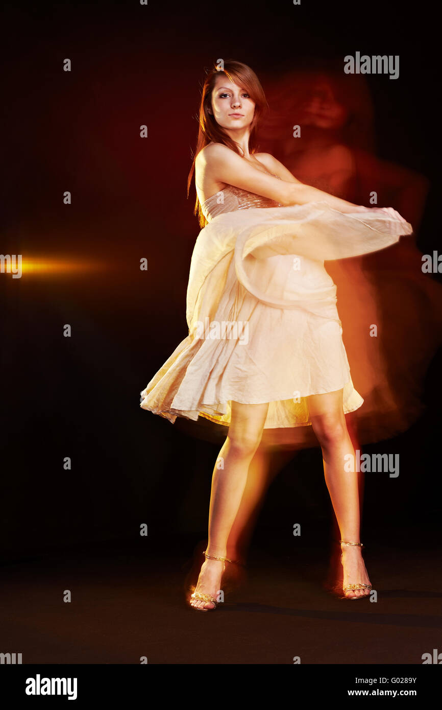 Beautiful young female wearing dress, dancing, multiple exposure non ...