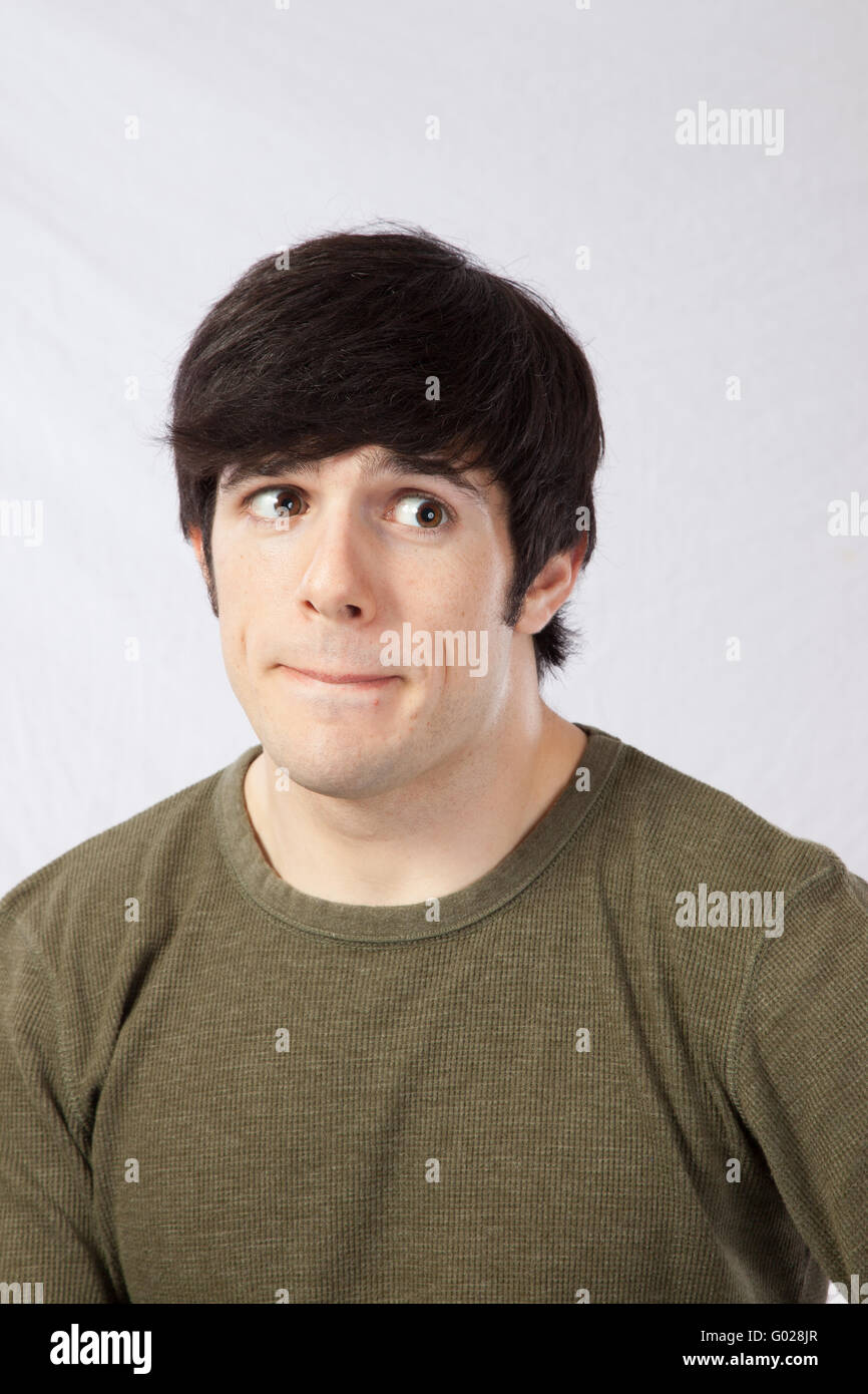 Handsome man looking worried Stock Photo - Alamy