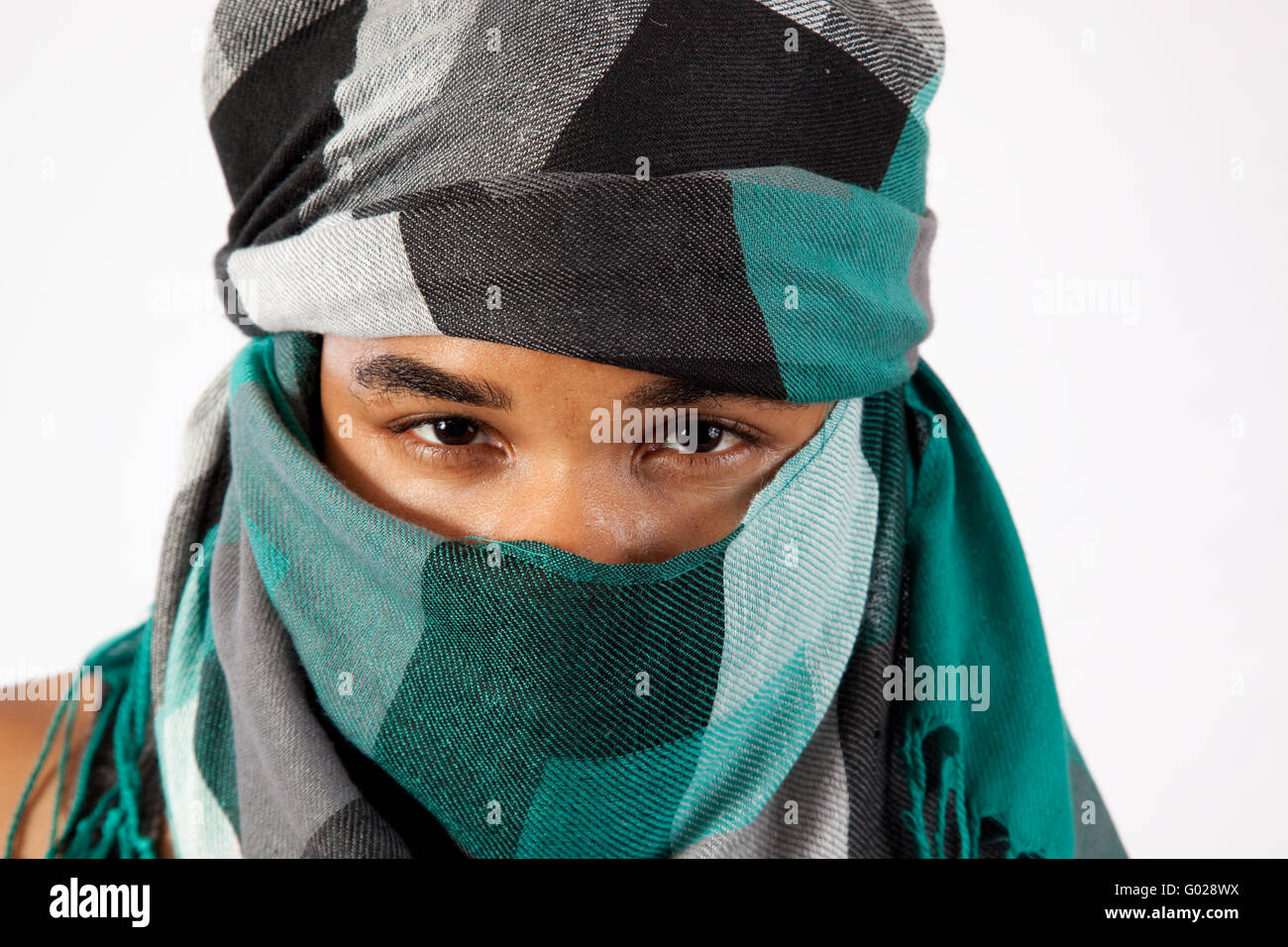 Young black man wearing a head scarf and looking serious Stock Photo ...
