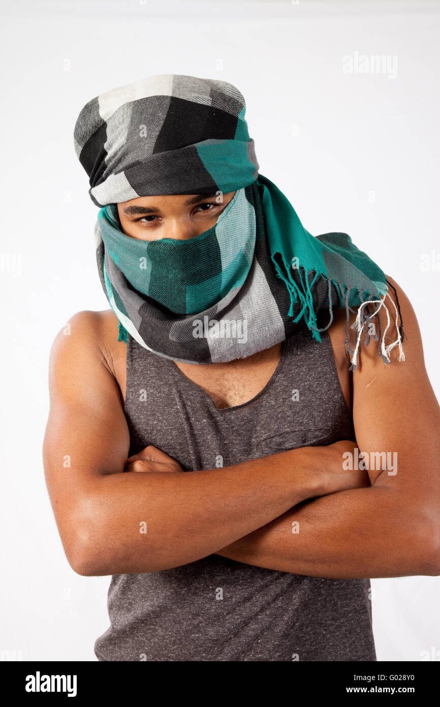 Young black man wearing a head scarf and looking serious Stock Photo ...