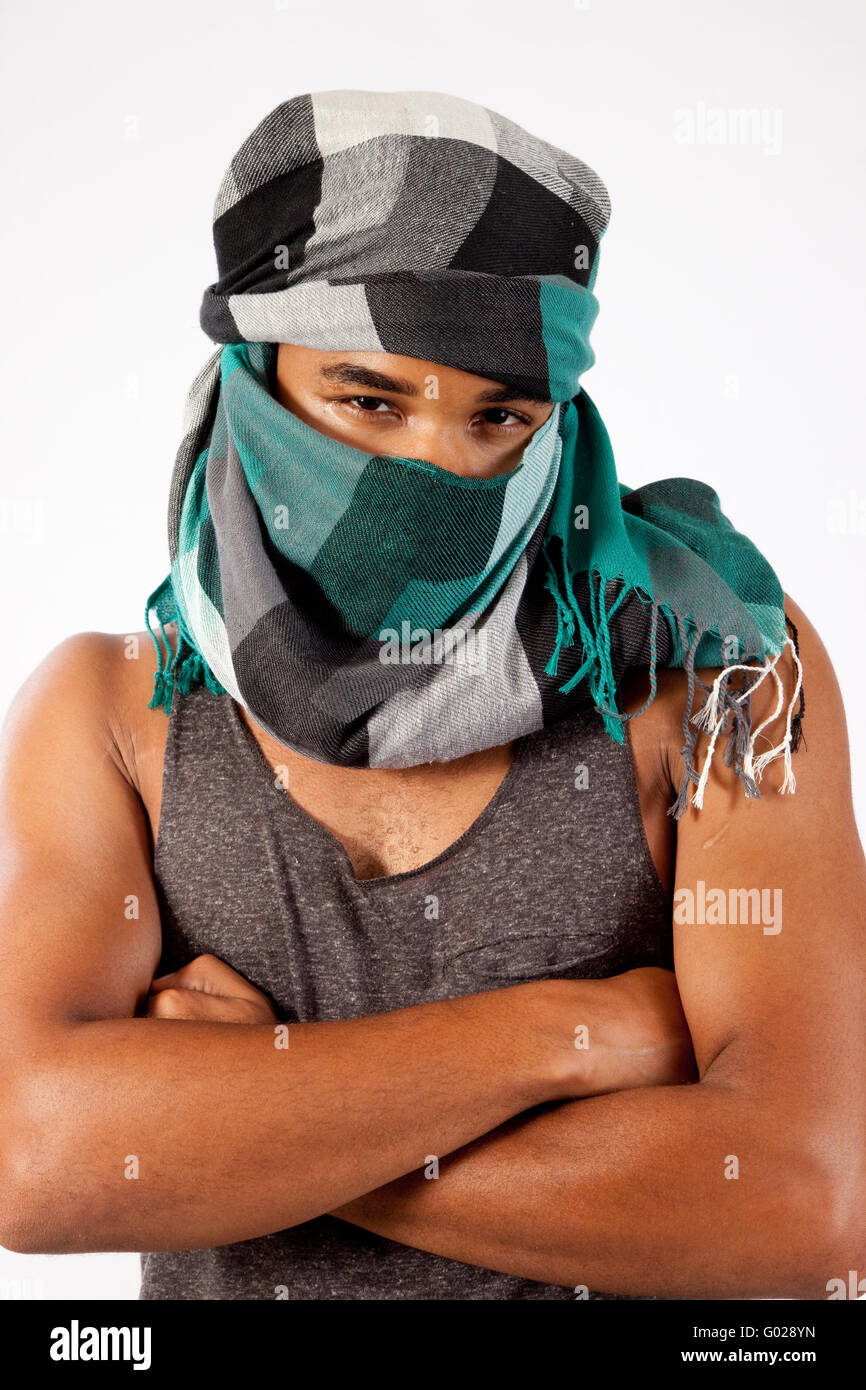 Young black man wearing a head scarf and looking serious Stock Photo ...