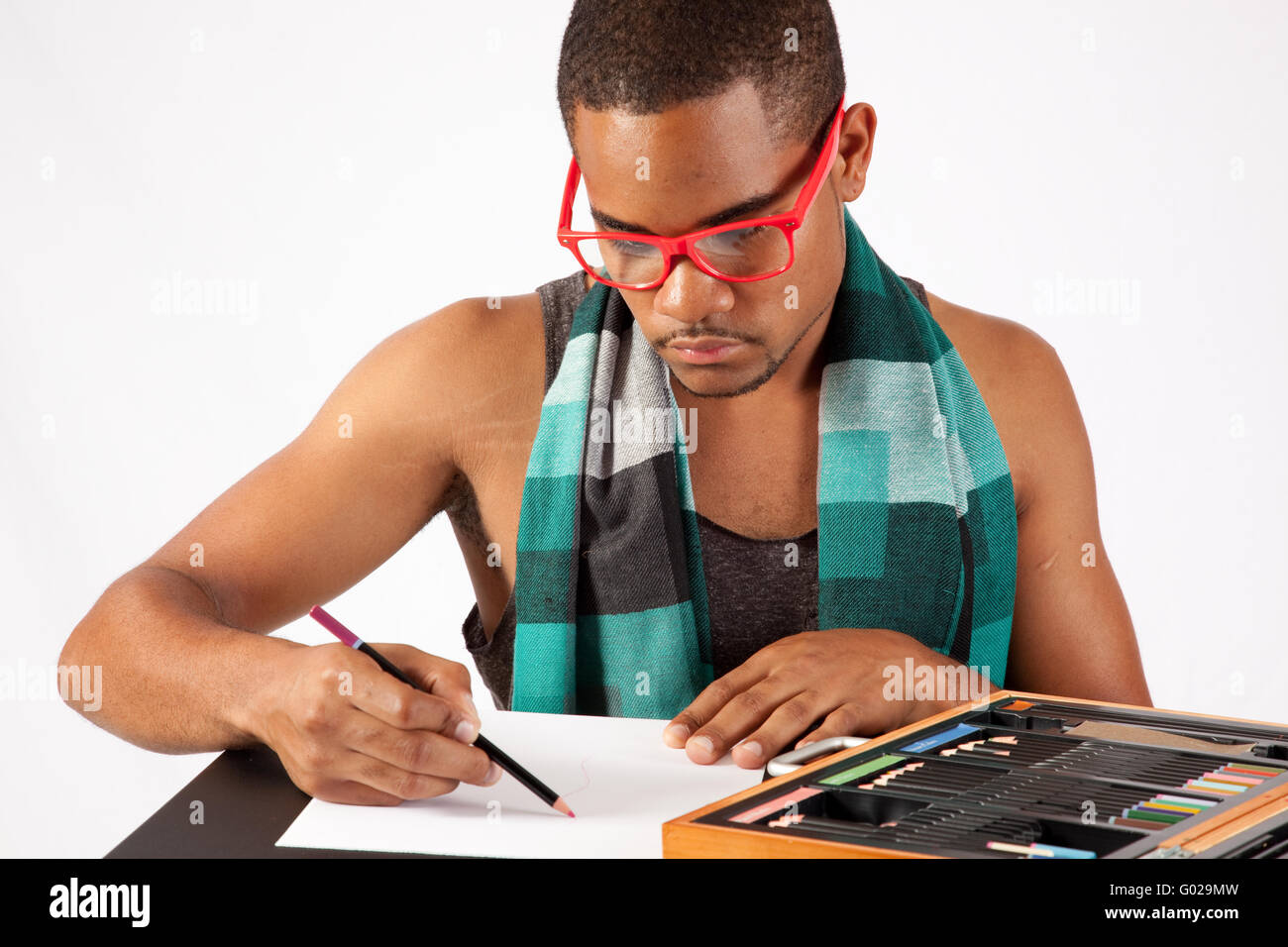Handsome black man drawing on paper with pastel Stock Photo - Alamy