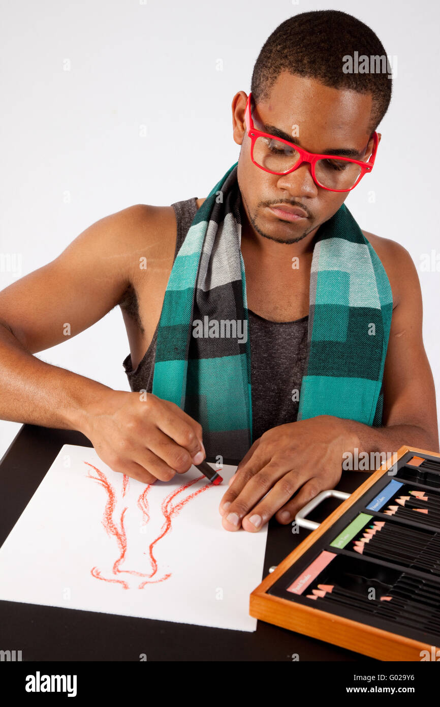 Handsome black man drawing on paper with pastel Stock Photo - Alamy