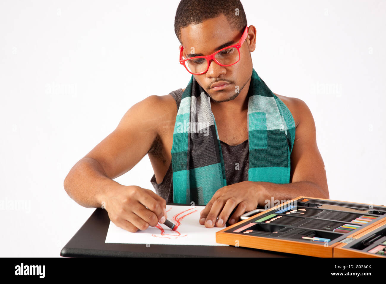 Handsome black man drawing on paper with pastel Stock Photo - Alamy