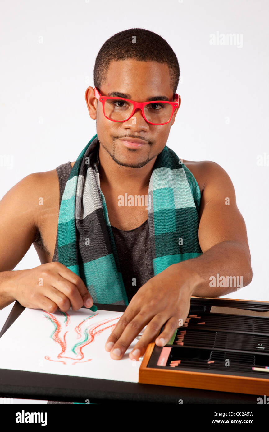 Handsome black man drawing on paper with pastel Stock Photo - Alamy