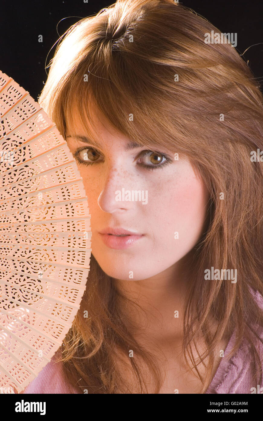 Woman with a Fan Stock Photo - Alamy