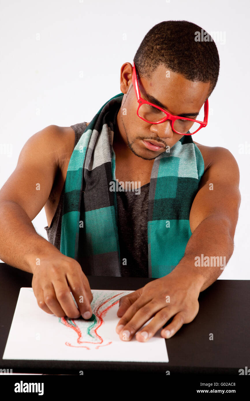 Handsome black man drawing on paper with pastel Stock Photo - Alamy