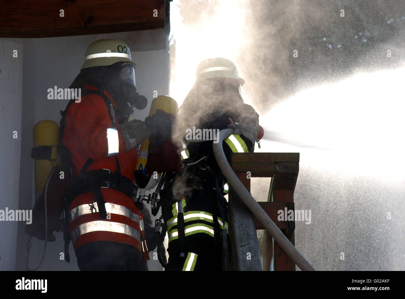 Fire department at the fire fighting operation Stock Photo - Alamy