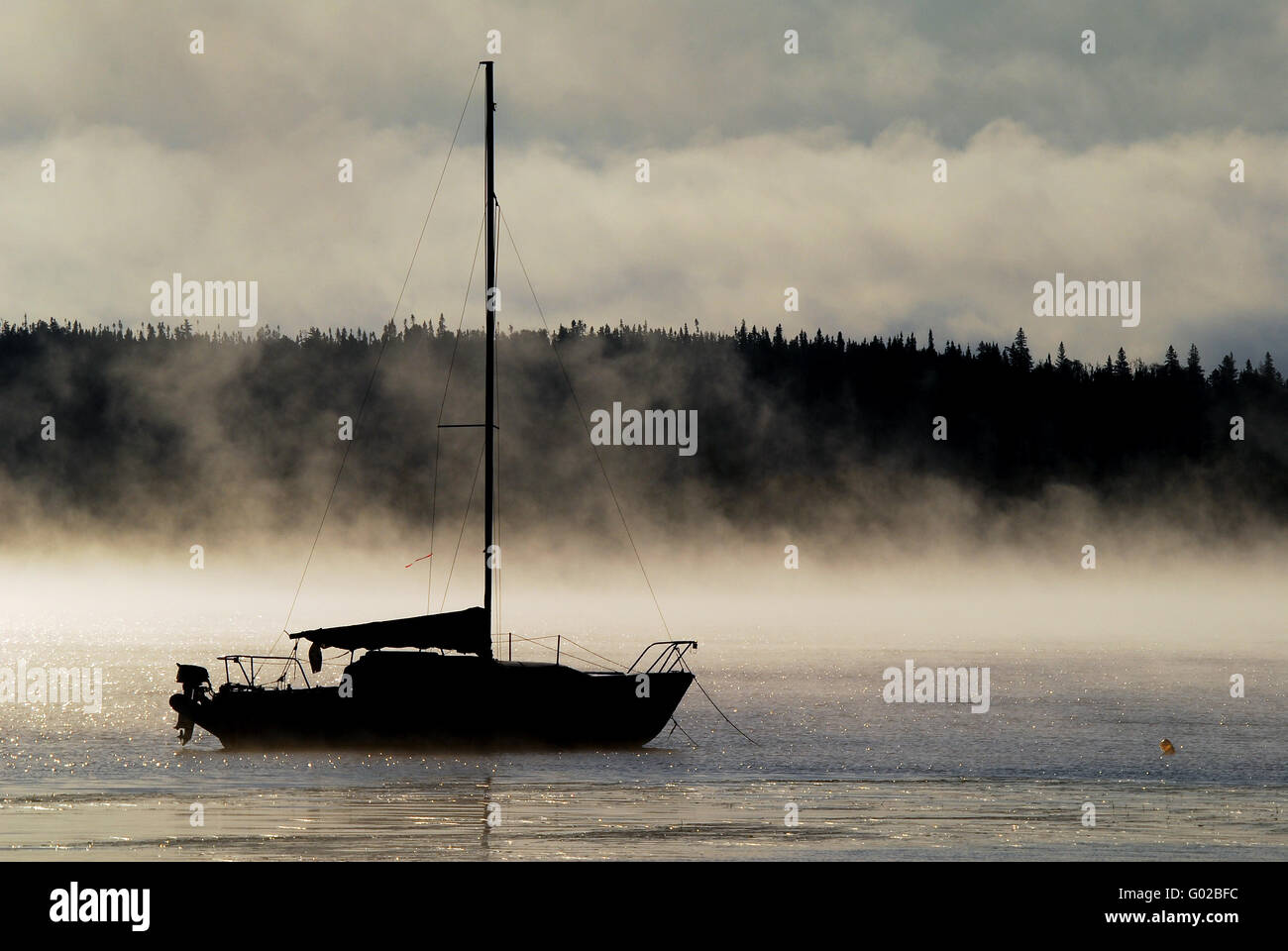 Sailboat sailing in mist lake hi-res stock photography and images - Alamy