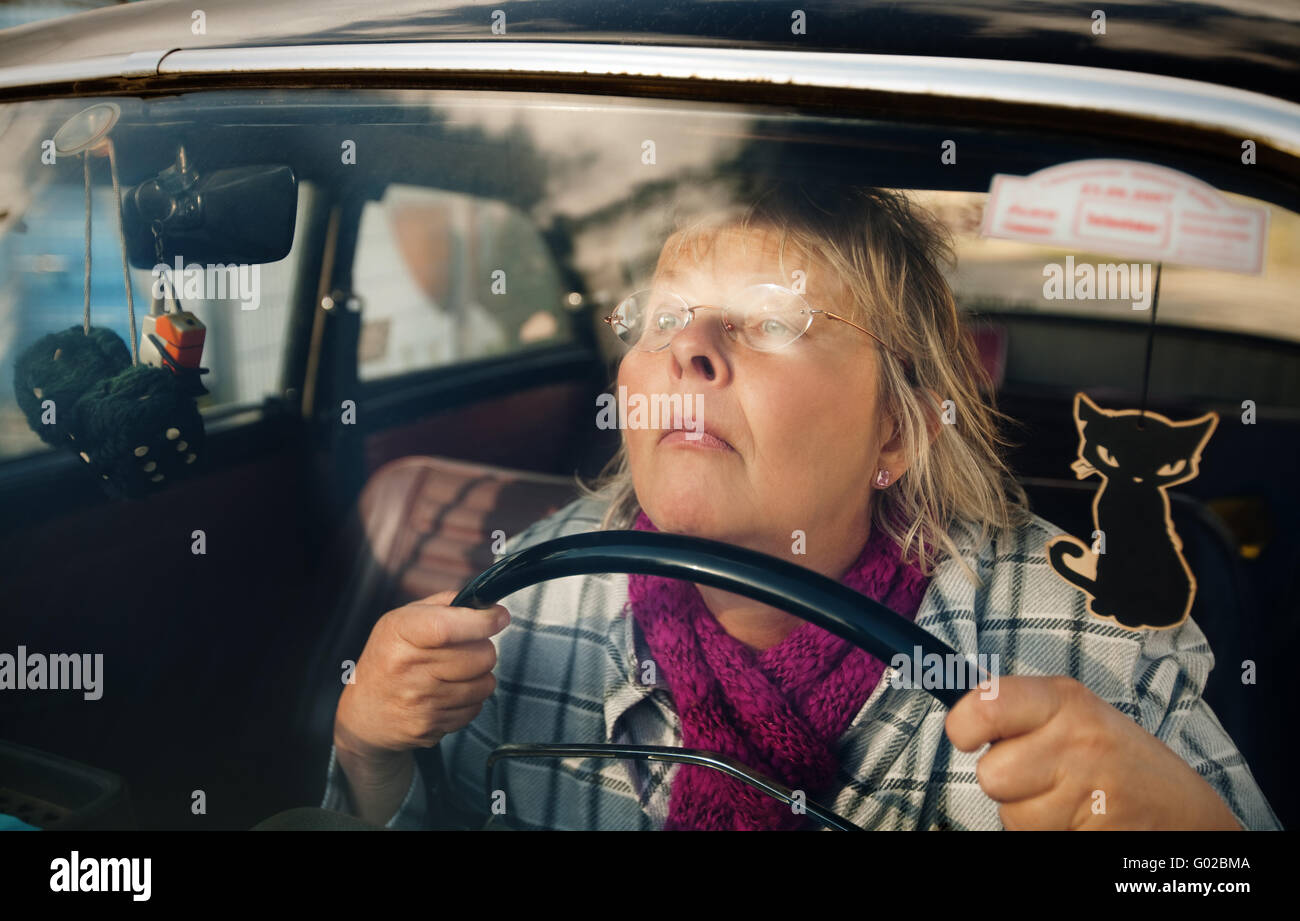Senior woman in oldtimer car Stock Photo - Alamy