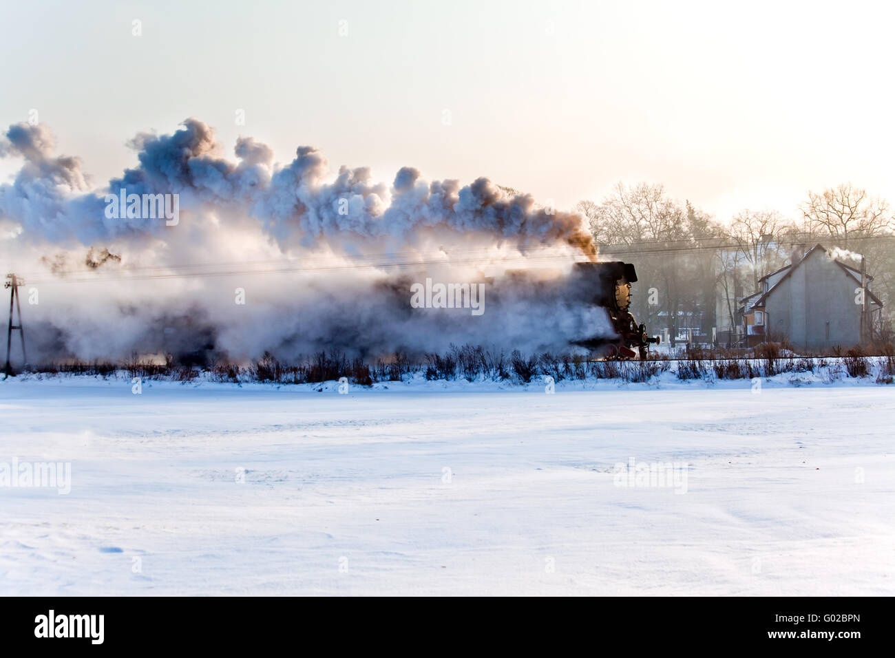 Vintage steam train starting from the station Stock Photo - Alamy