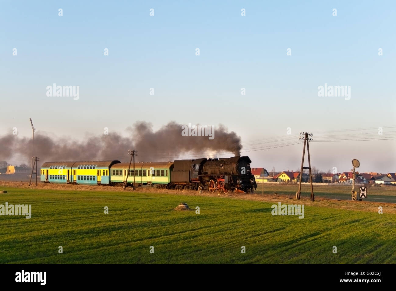Vintage steam train passing through countryside Stock Photo - Alamy