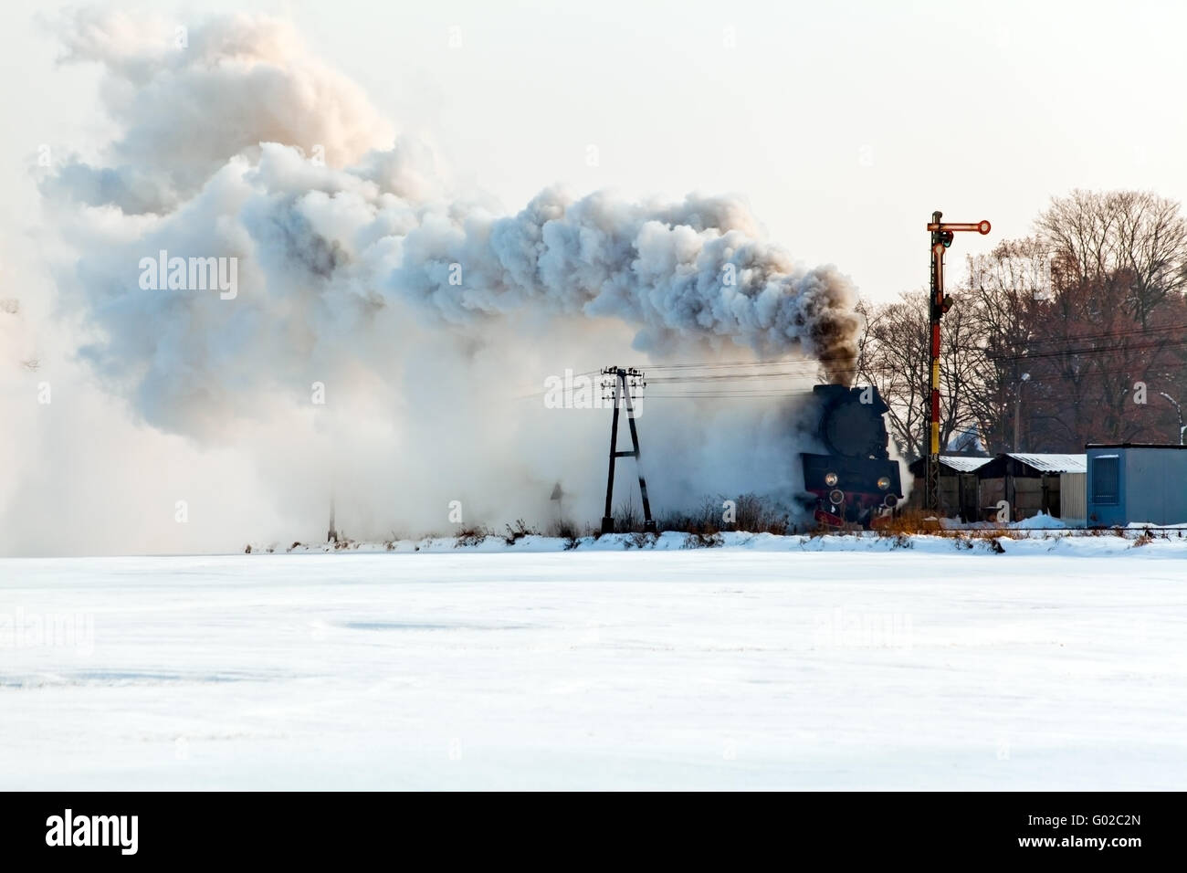 Vintage steam train starting from the station Stock Photo - Alamy