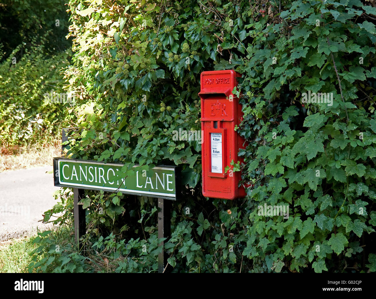 Mail Post Letter Box and road sign Stock Photo - Alamy