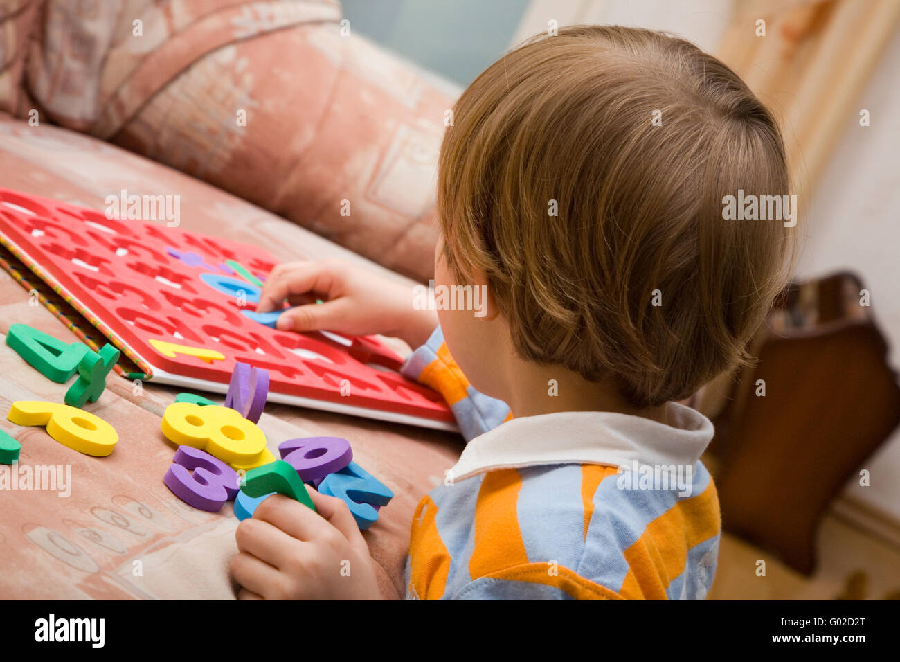 Young boy with plastic numbers Stock Photo - Alamy
