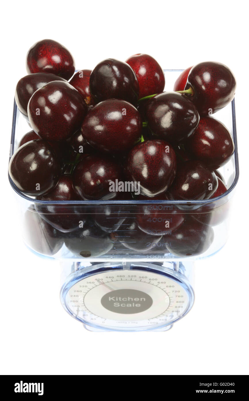 Kitchen scales and cherries Stock Photo - Alamy