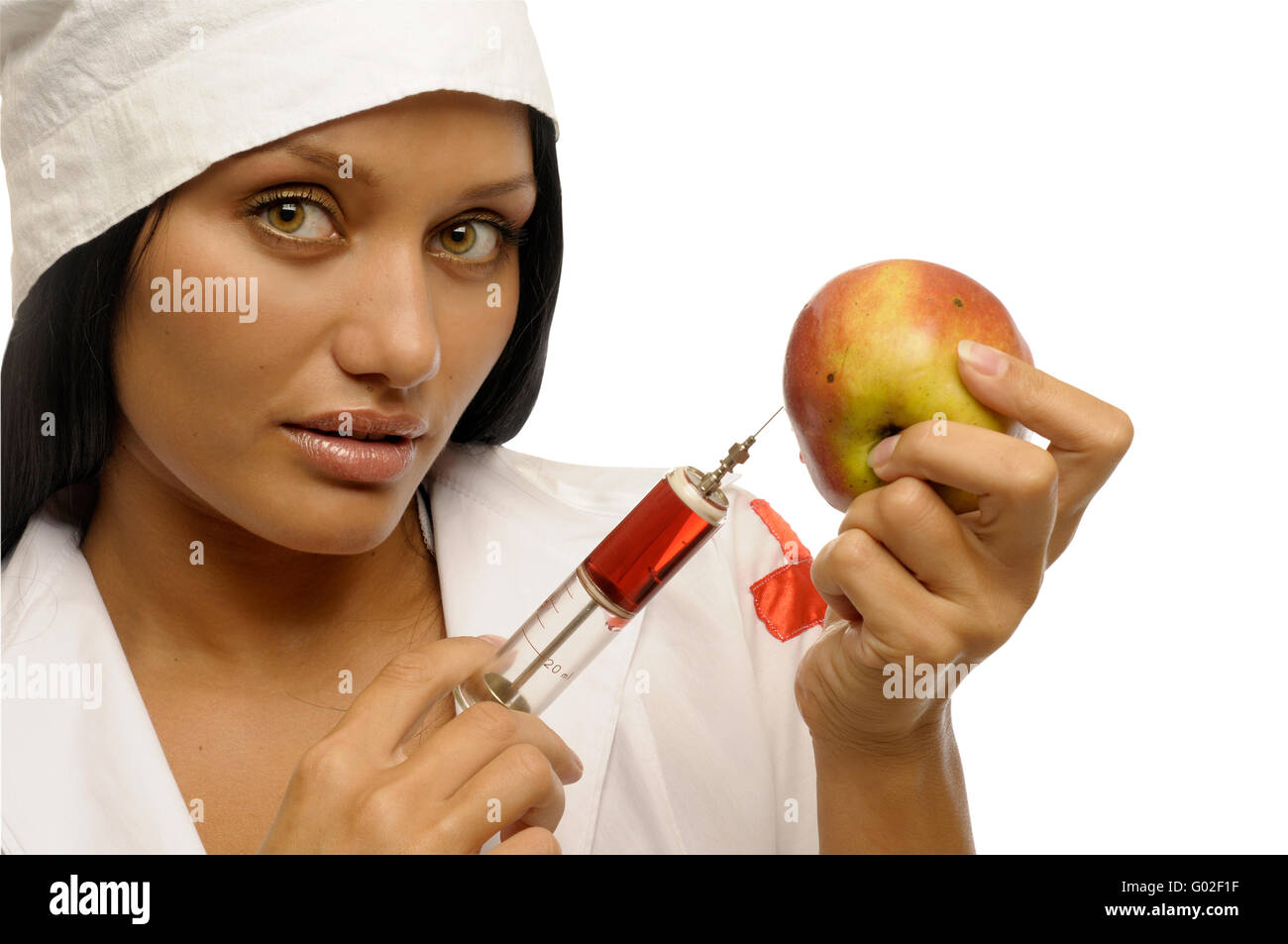beautiful girl in doctor clothes is making the injection to apple Stock ...