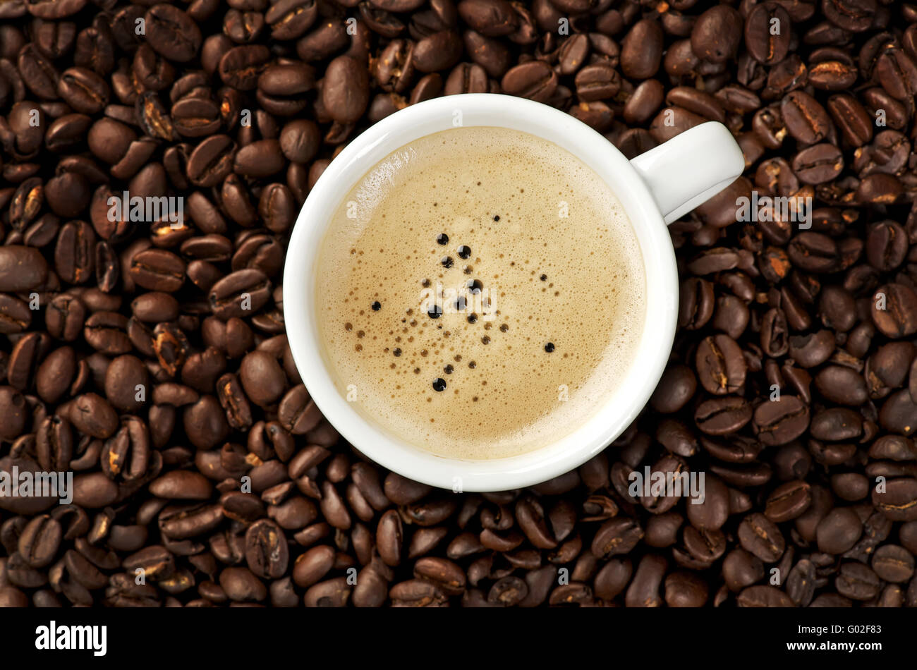 Cappucino on coffee beans Stock Photo - Alamy