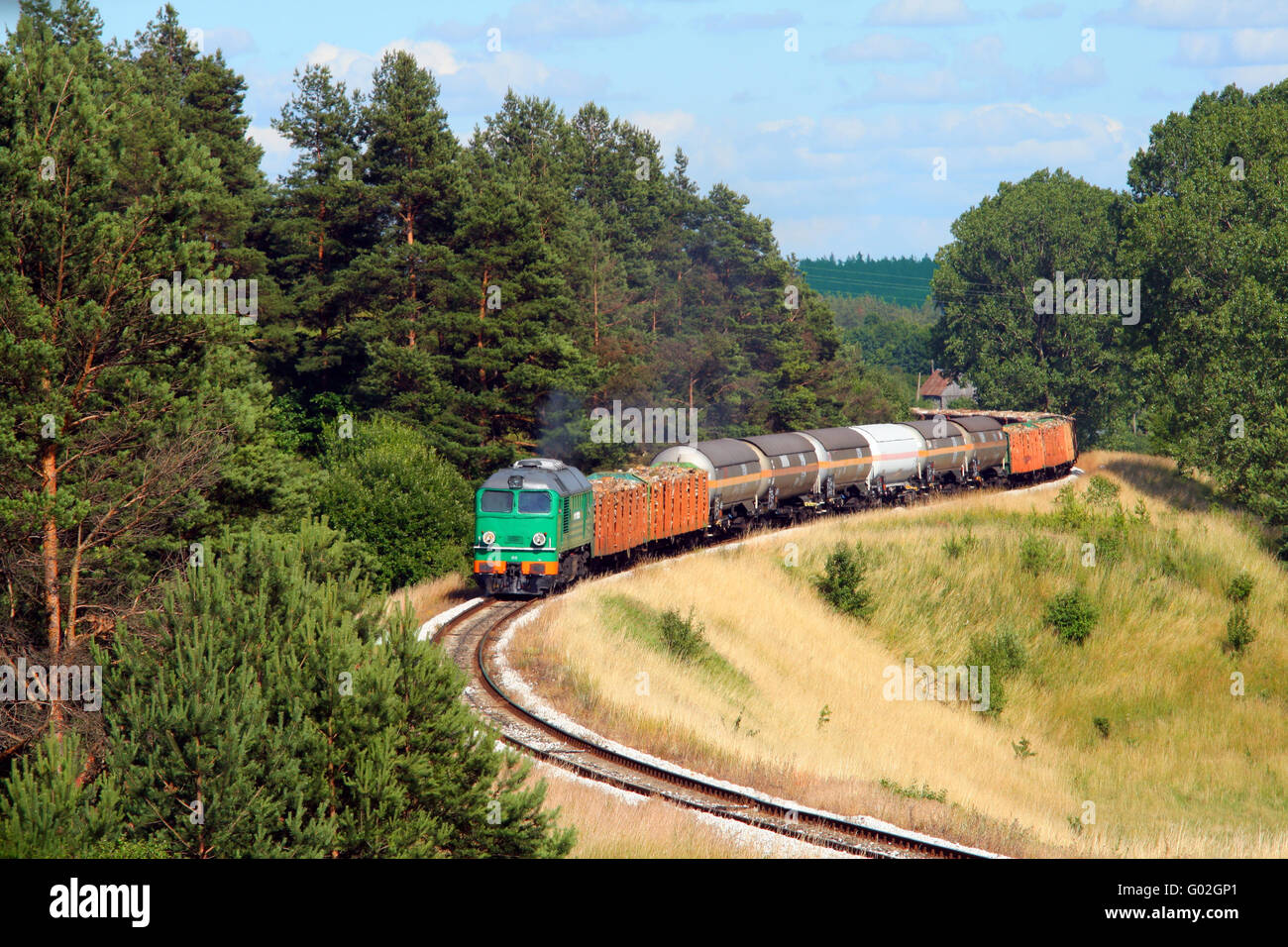 Freight train hauled by the diesel locomotive is passing its route ...