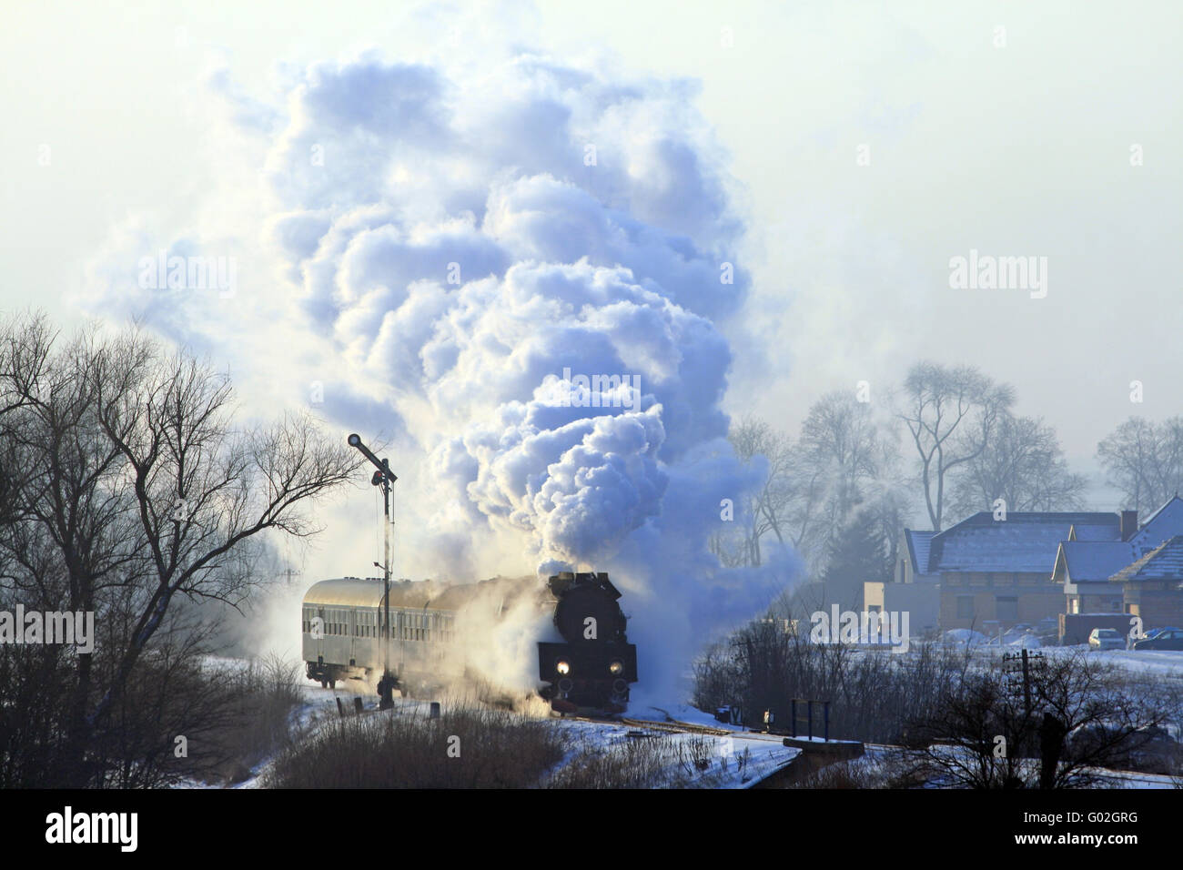 Vintage steam train starting from the station during wintertime Stock ...