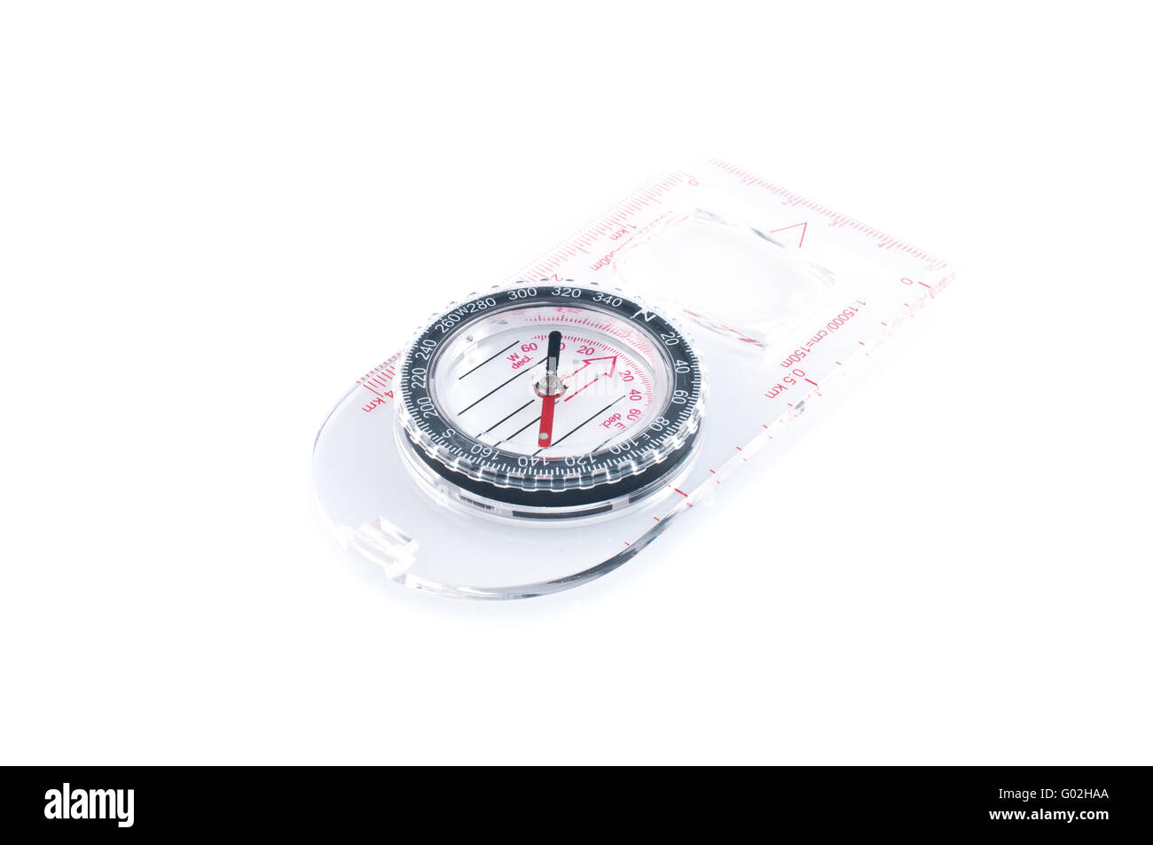 Transparent plastic compass on white background Stock Photo - Alamy