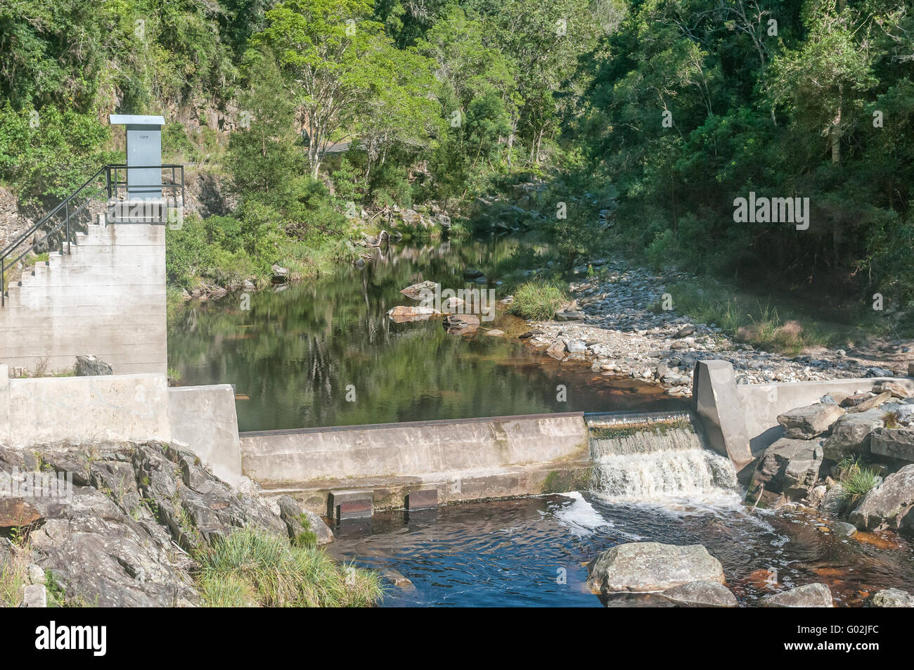 A small concrete dam at the old bridge over the Bloukrans River in the ...