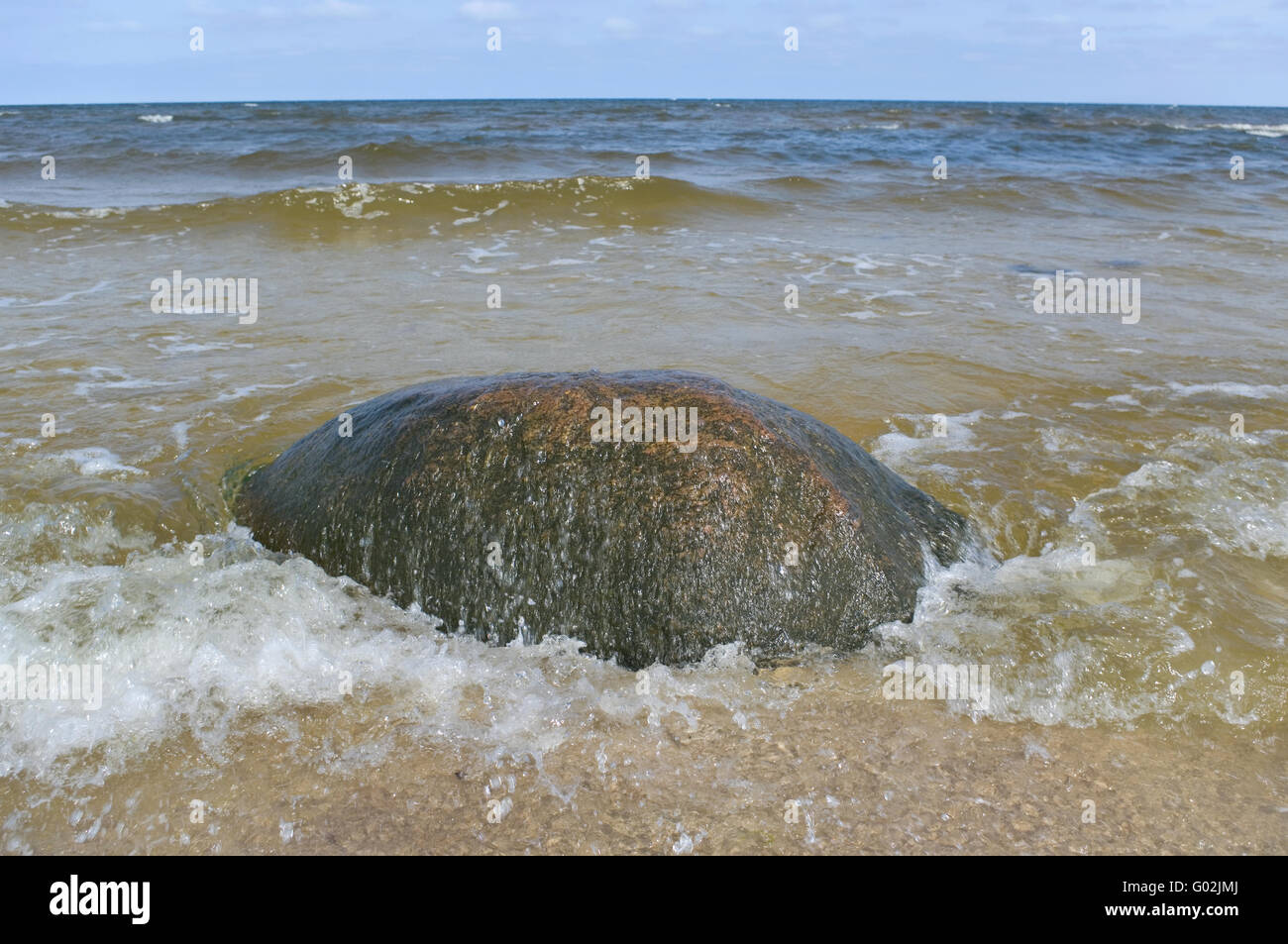Wet stone in the sea`s water Stock Photo - Alamy