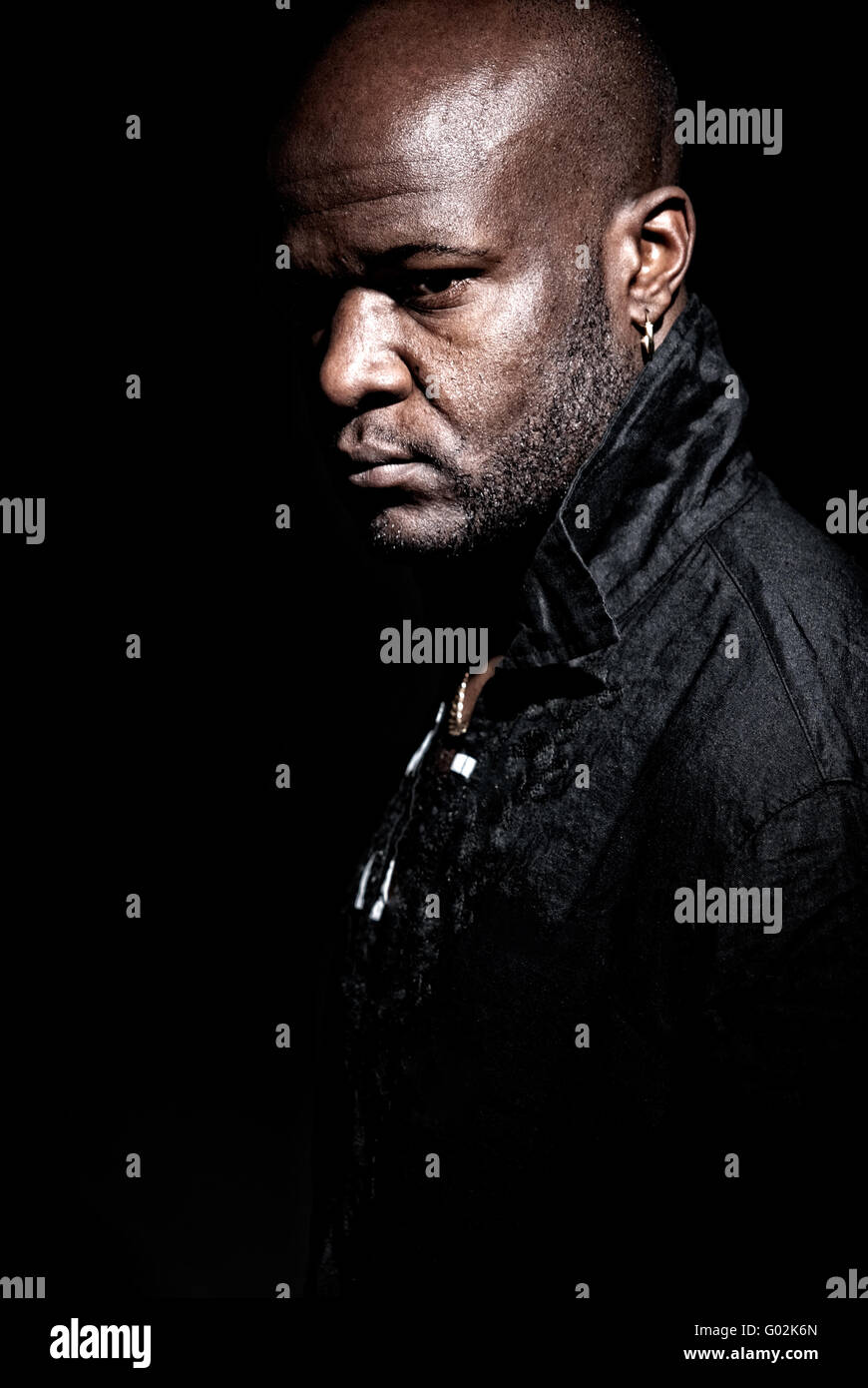 Black gangster men looking serious high contrast low key Stock Photo ...
